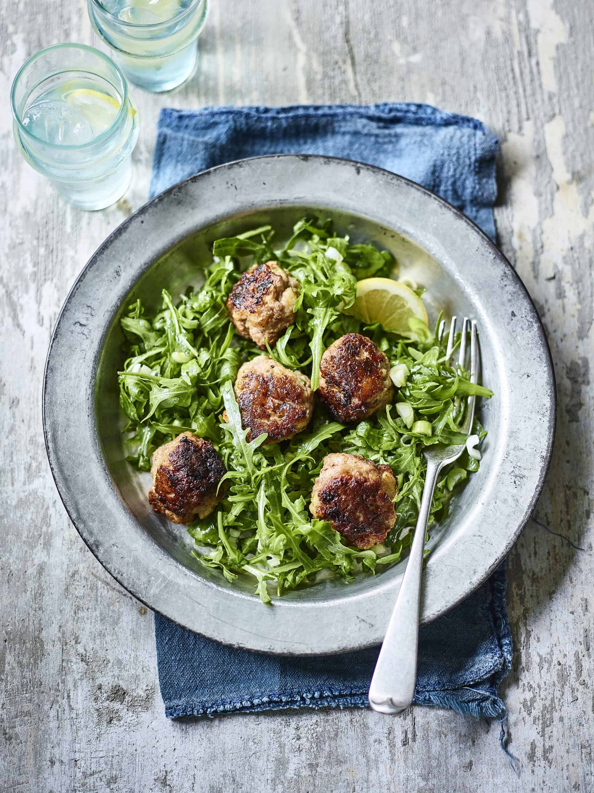 LEMON TURKEY MEATBALLS ON A BED OF WILTED ROCKET